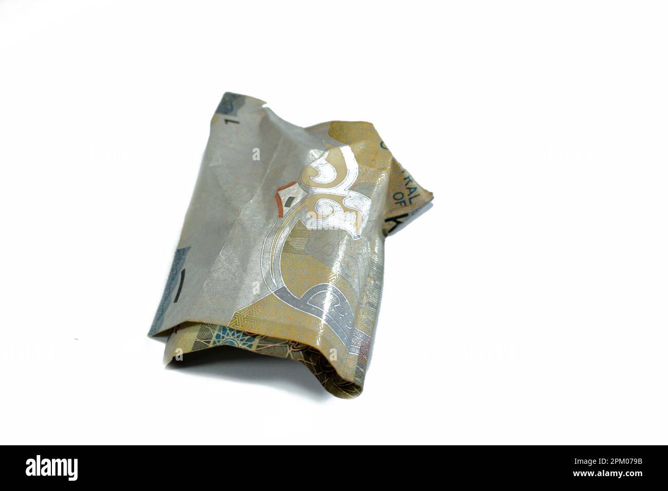 Selective focus of crumpled Kuwaiti money of 1 KWD one Kuwait dinar ...
