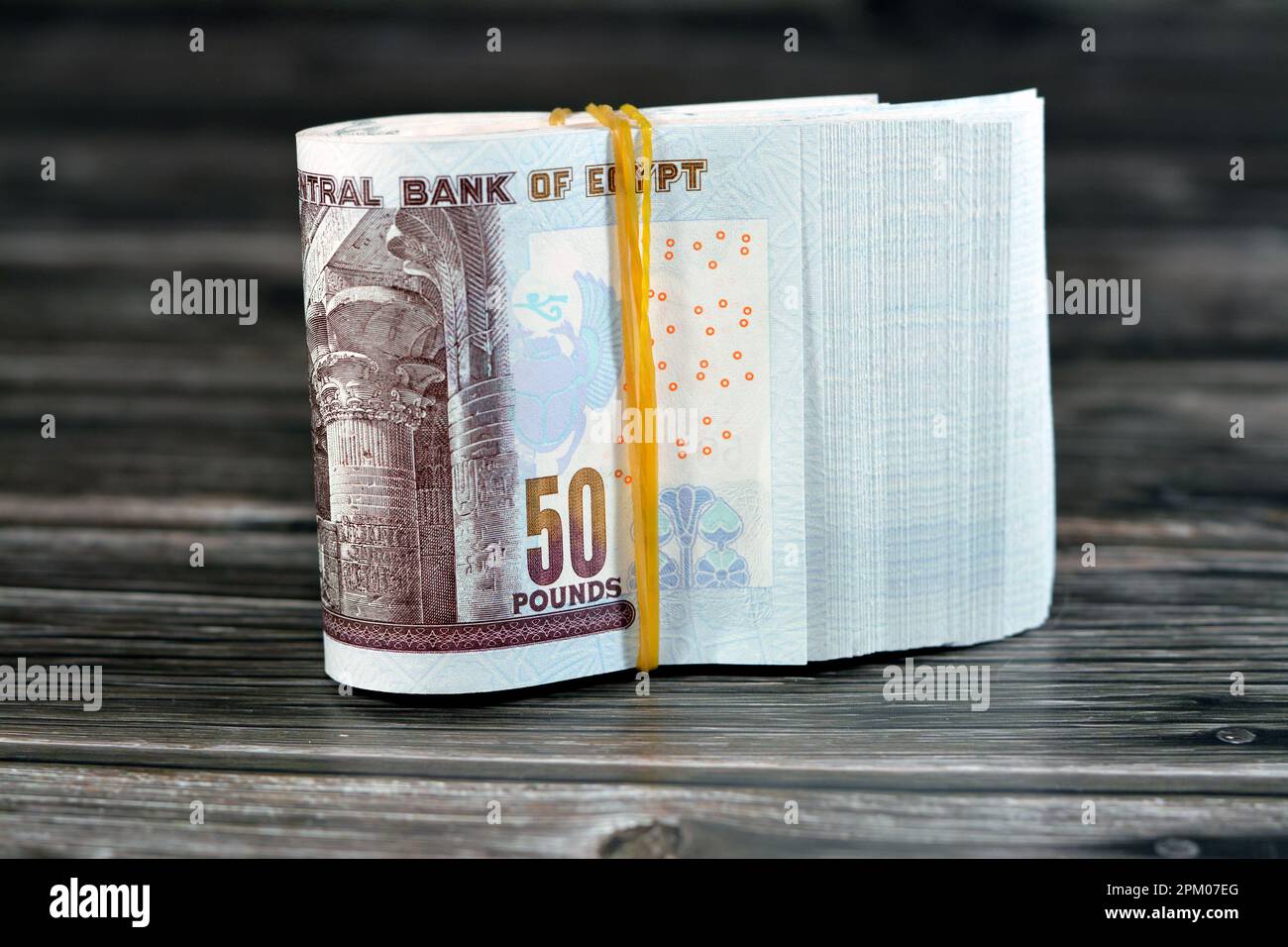 Folded 50 EGP LE fifty Egyptian pounds cash money bills rolled with ...