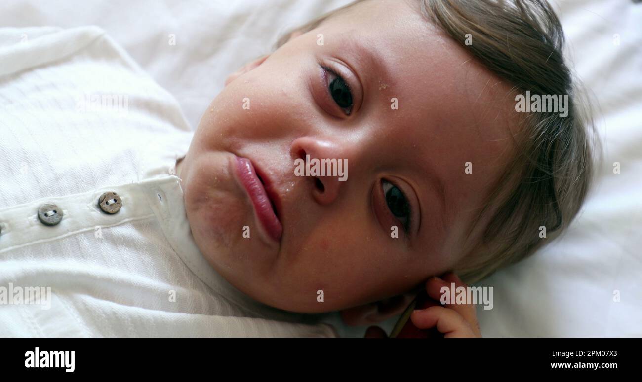 Tearful baby toddler crying. One year told child cries Stock Photo - Alamy