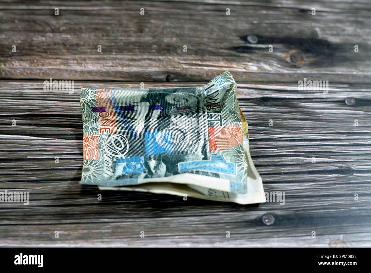 Selective focus of crumpled Kuwaiti money of 1 KWD one Kuwait dinar ...