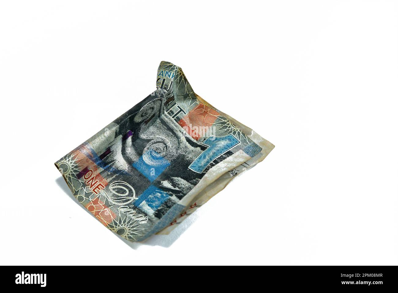 Selective focus of crumpled Kuwaiti money of 1 KWD one Kuwait dinar ...