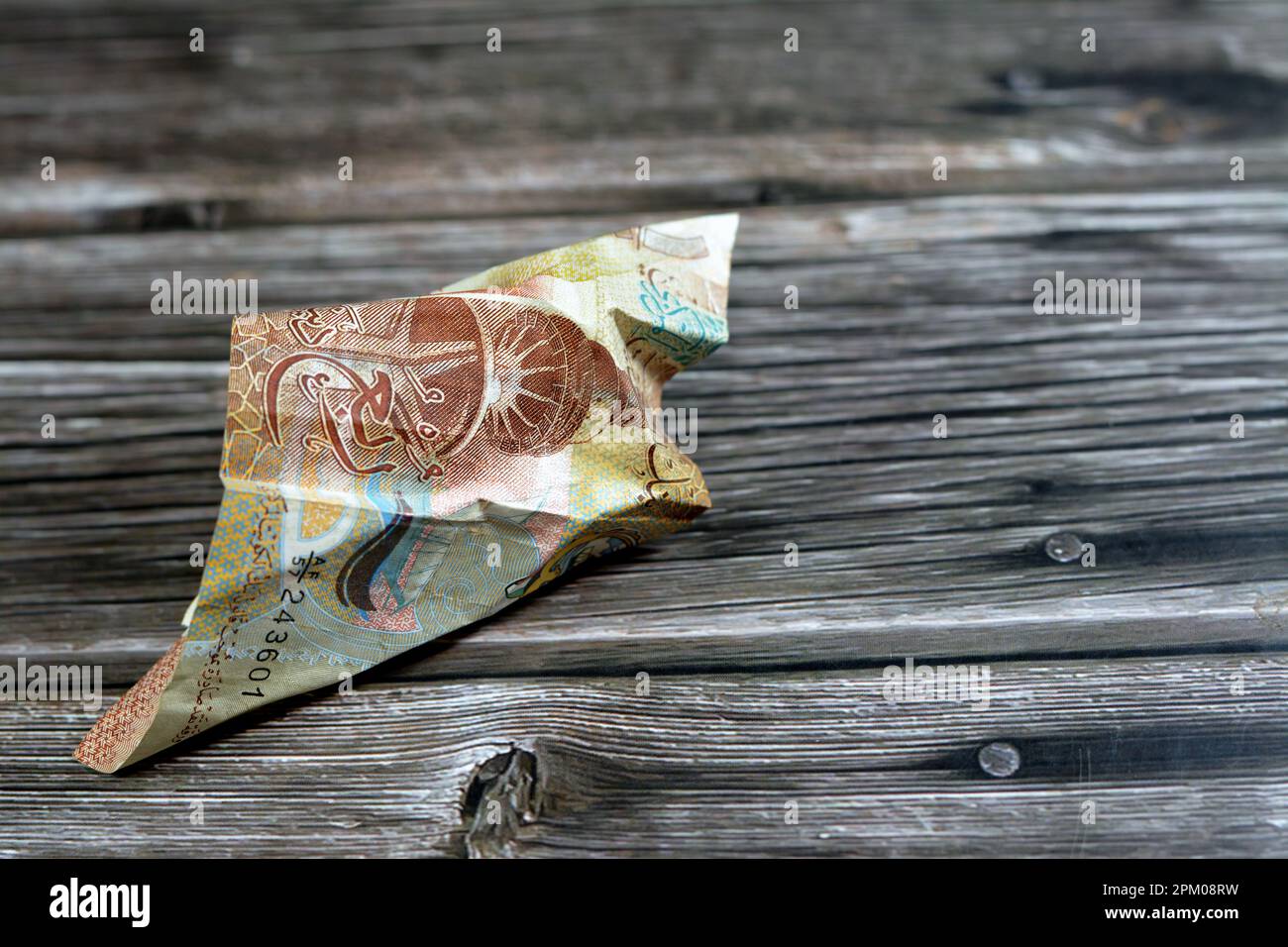 Crumpled Kuwaiti money of change KWD quarter Kuwait dinar bill banknote ...