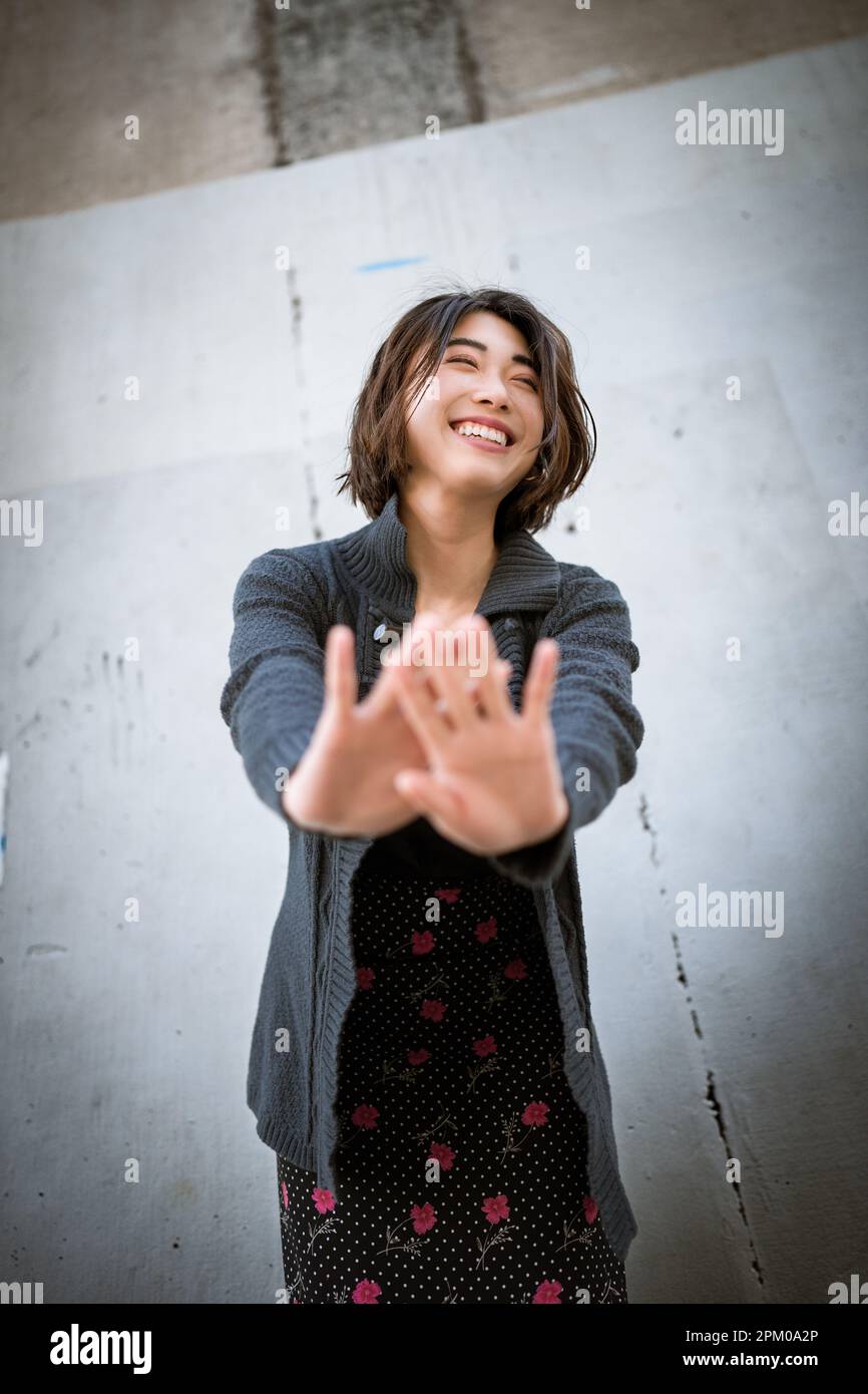 Woman holding up hand stop hi-res stock photography and images - Alamy