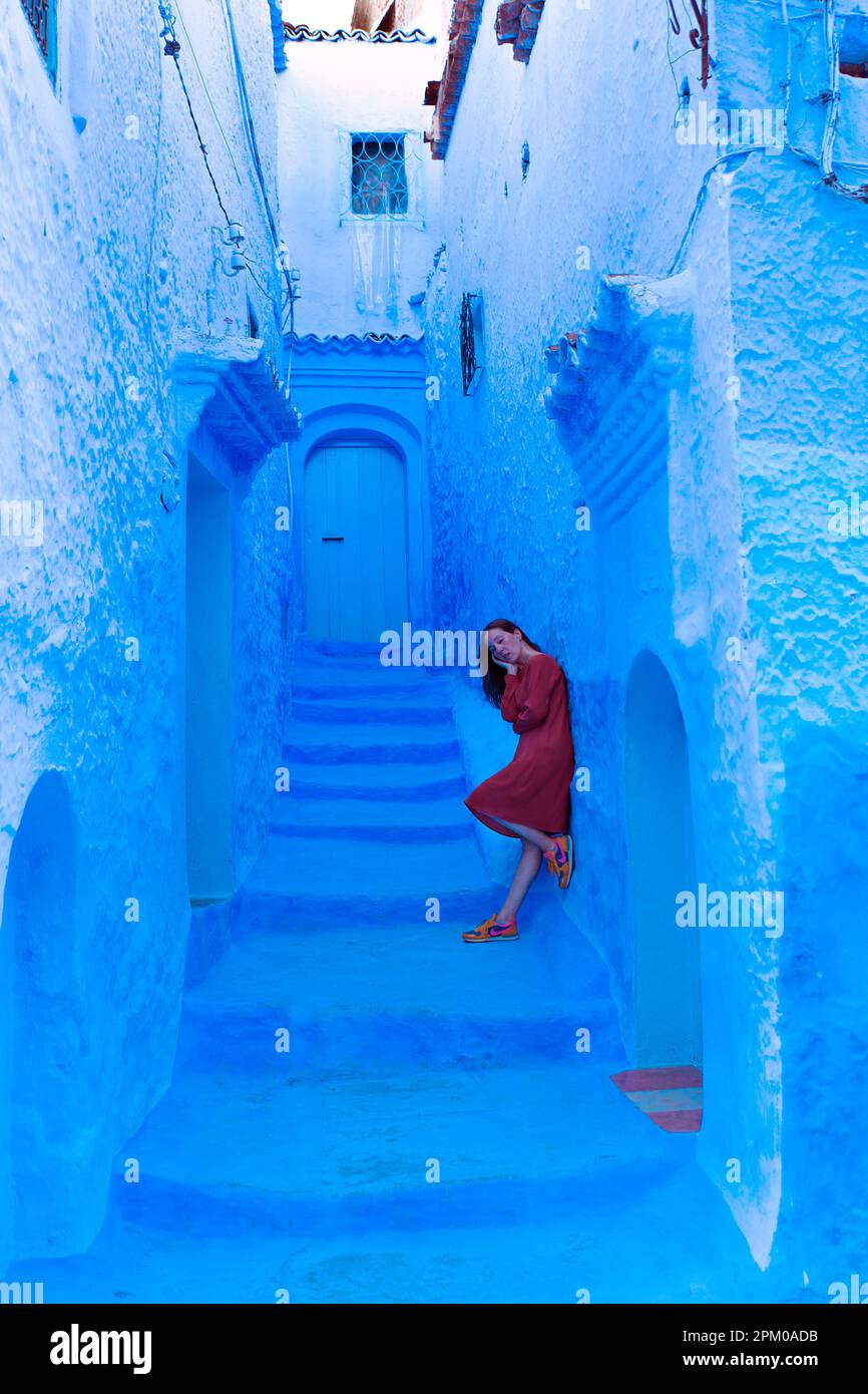 woman with orange dress in Chefchaouen II Stock Photo - Alamy