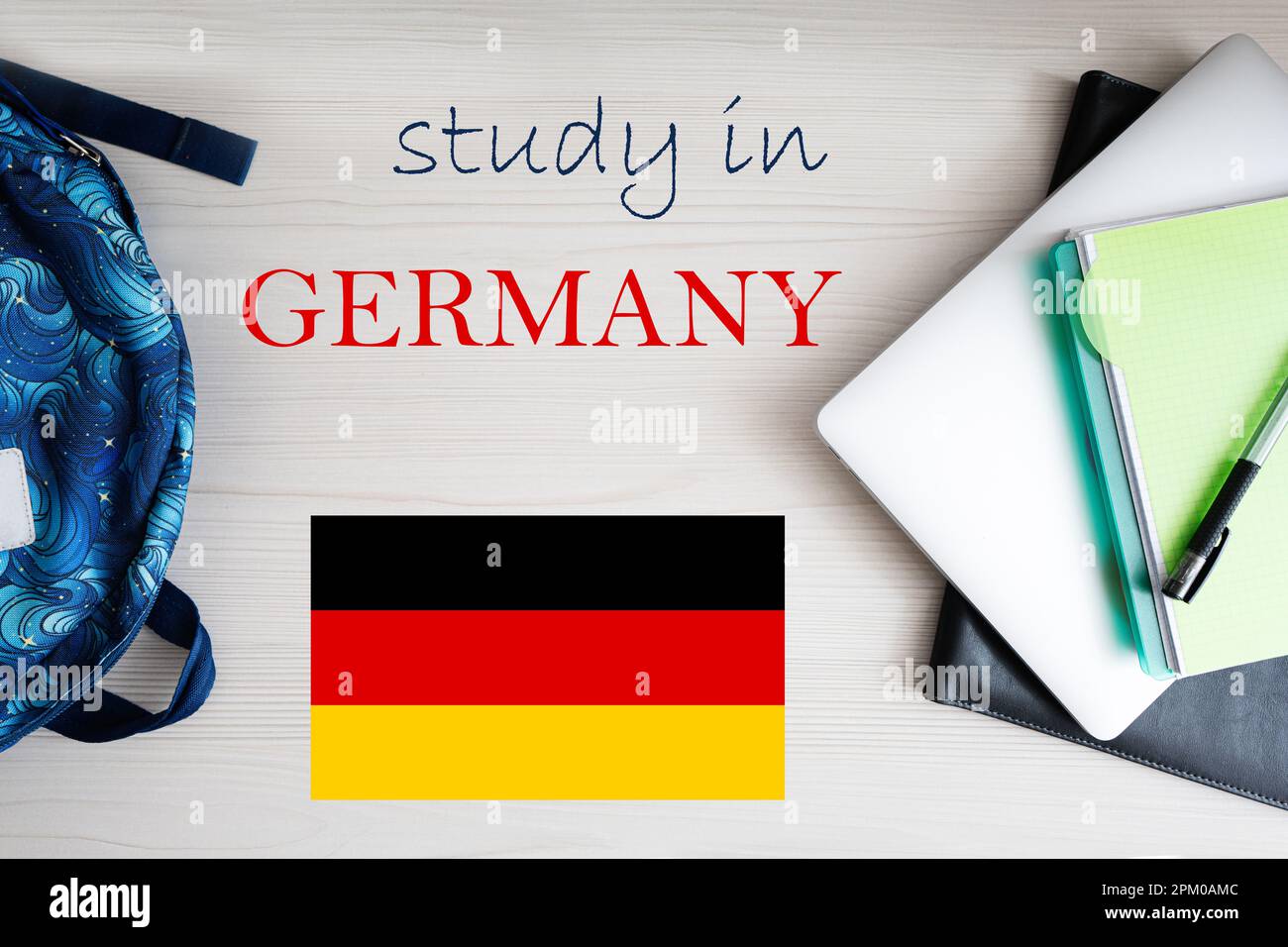Study in Germany. Background with notepad, laptop and backpack ...