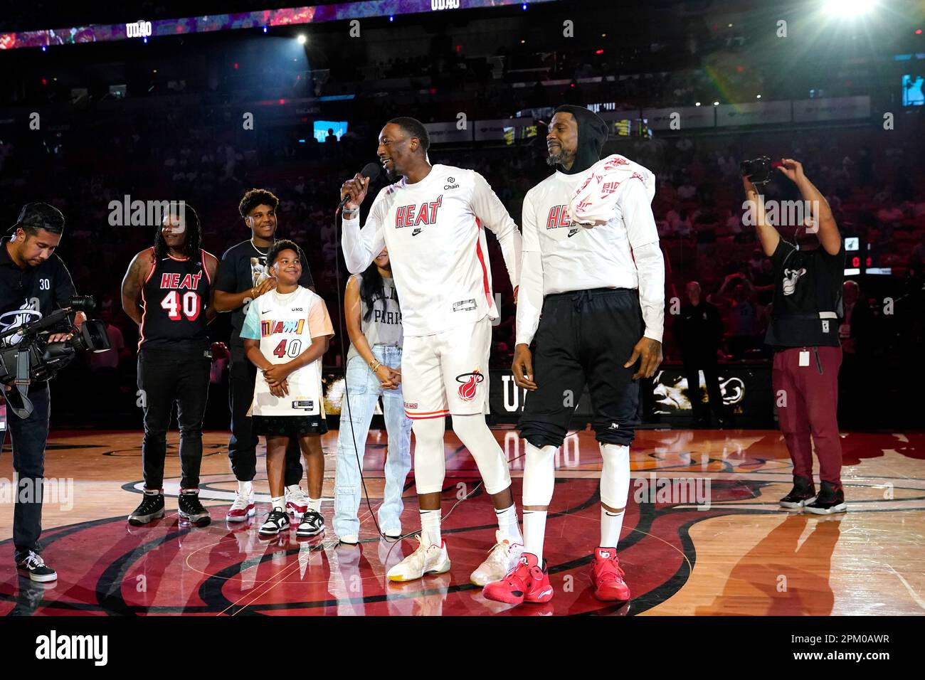 Miami Heat forward Udonis Haslem, right, listens as Miami Heat center Bam Adebayo speaks during ...