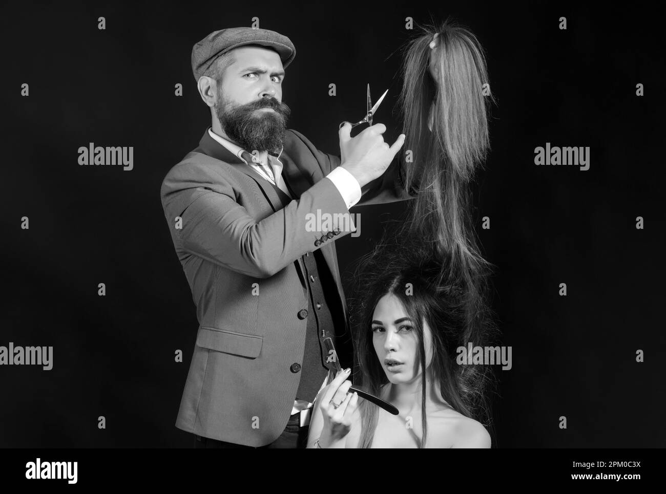 Barber scissors. Hairdresser makes hairstyle a woman with long hair ...