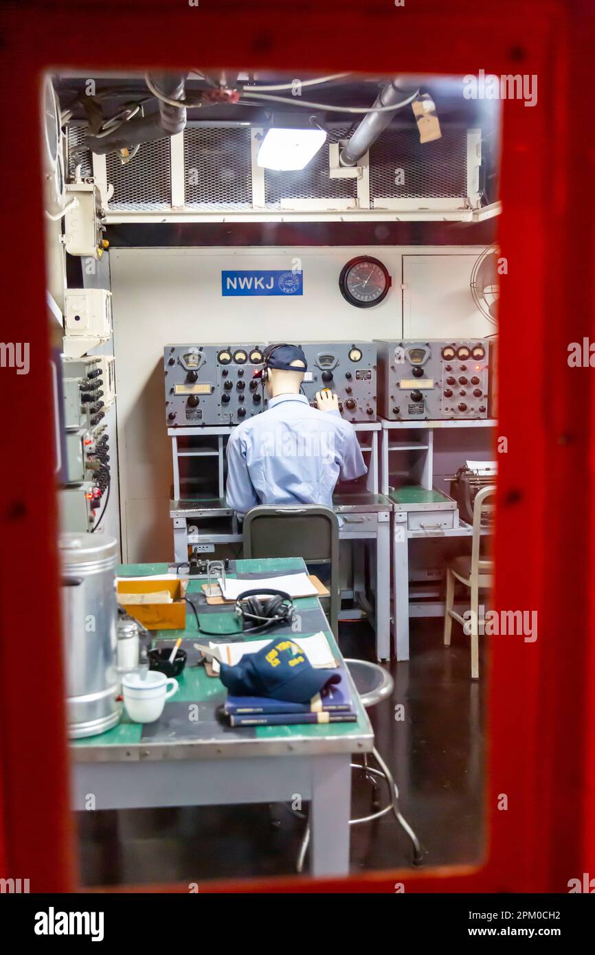 A mannequin simulates a radio operator on board the aircraft carrier ...