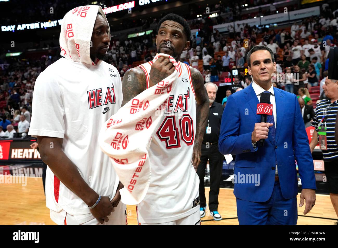 Miami Heat forward Udonis Haslem, center, stands with Miami Heat center Bam Adebayo, left, after ...
