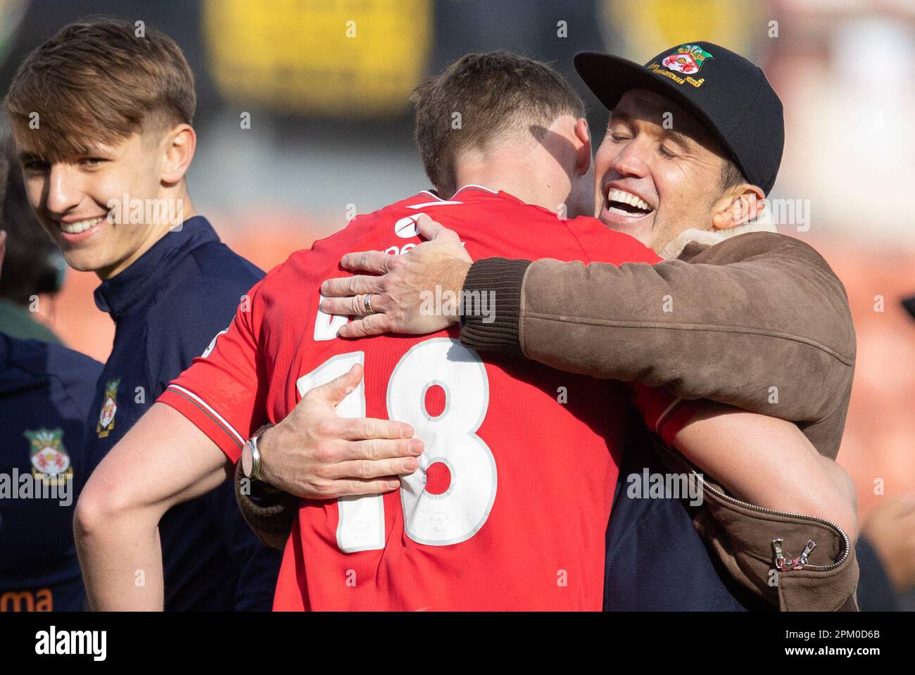 Wrexham, UK. 10th Apr, 2023. Co-Owner of Wrexham Rob McElhenny embraces ...