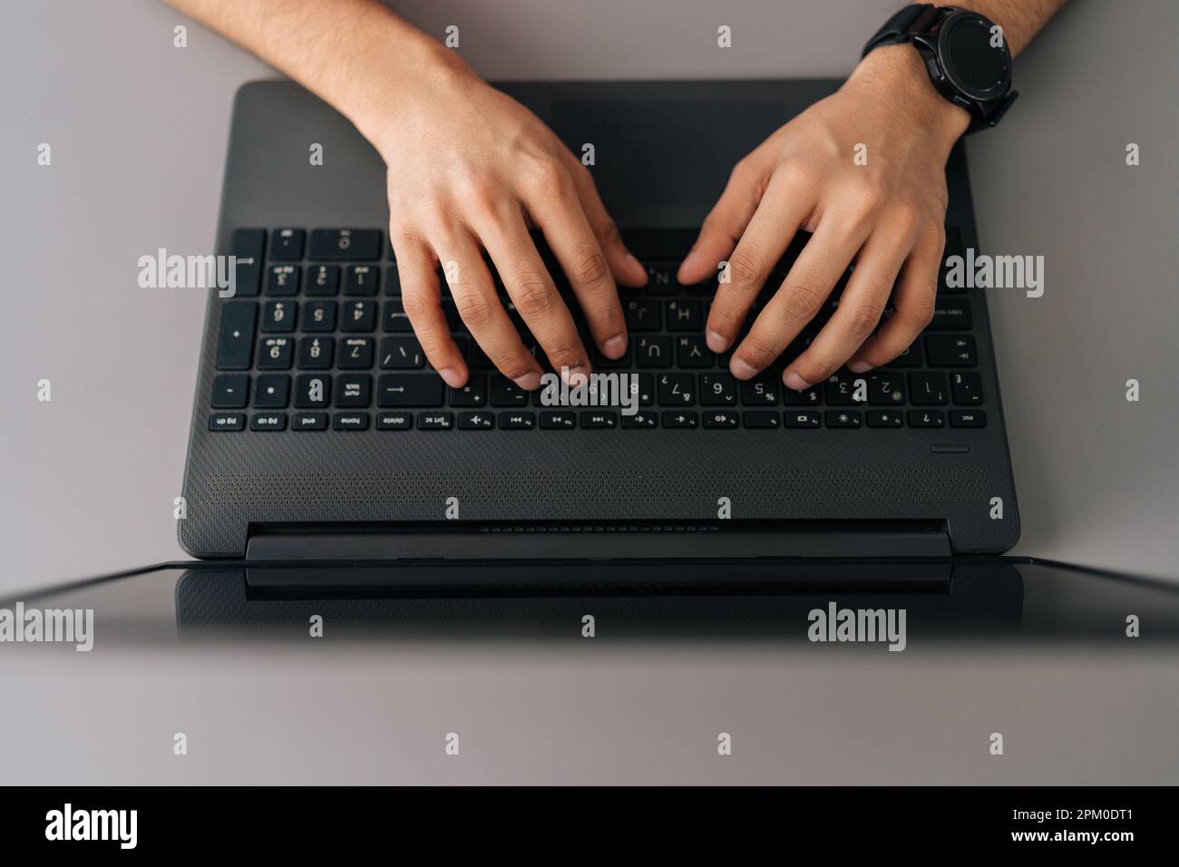Close-up top view of unrecognizable businessman wearing smartwatch ...