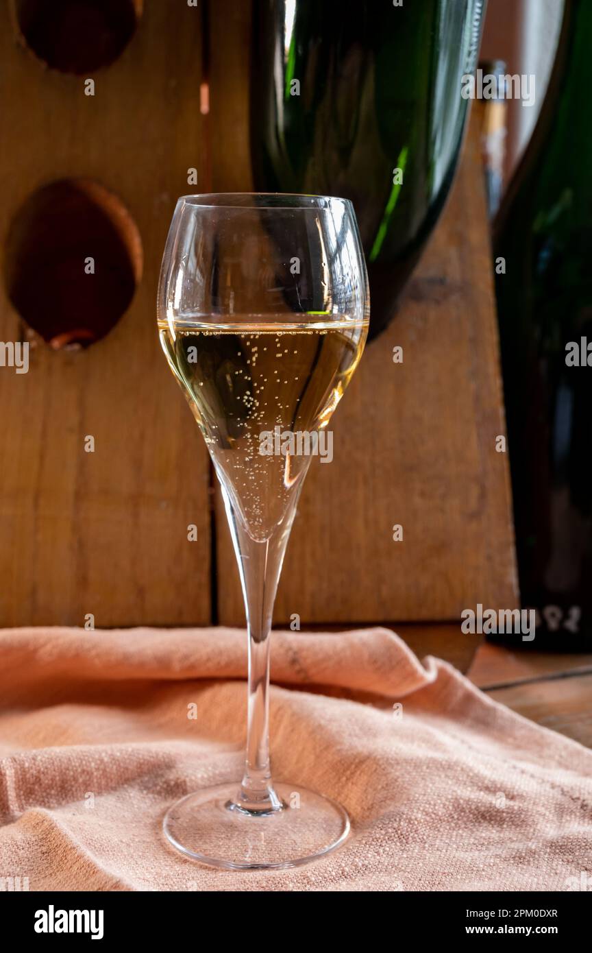 Glass of sparkling white wine champagne gran cru or cava with bubbles ...