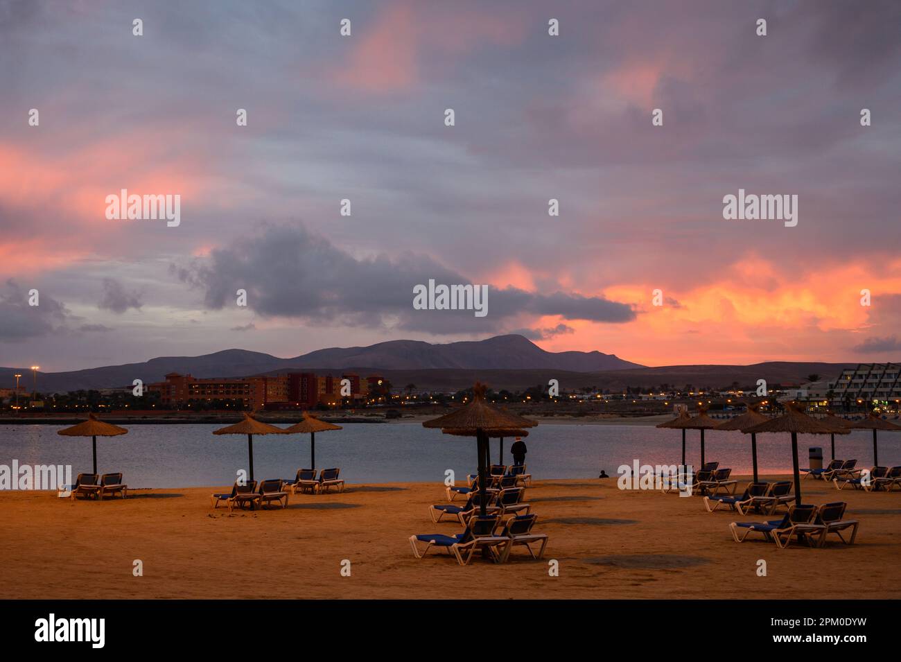 Sandy beach after sunset. Winter sea and sun vacation in Caleta de ...