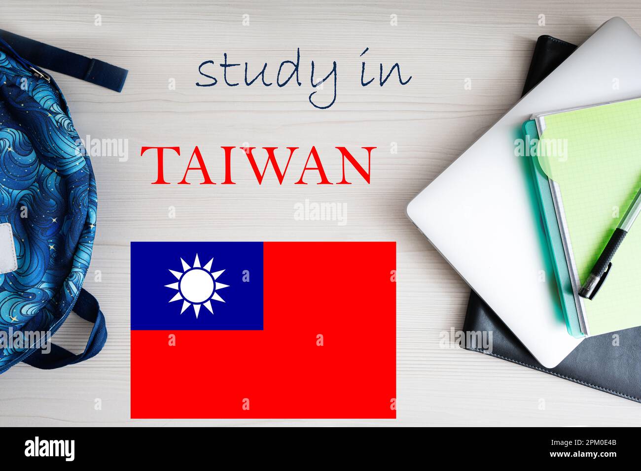 Study in Taiwan. Background with notepad, laptop and backpack ...