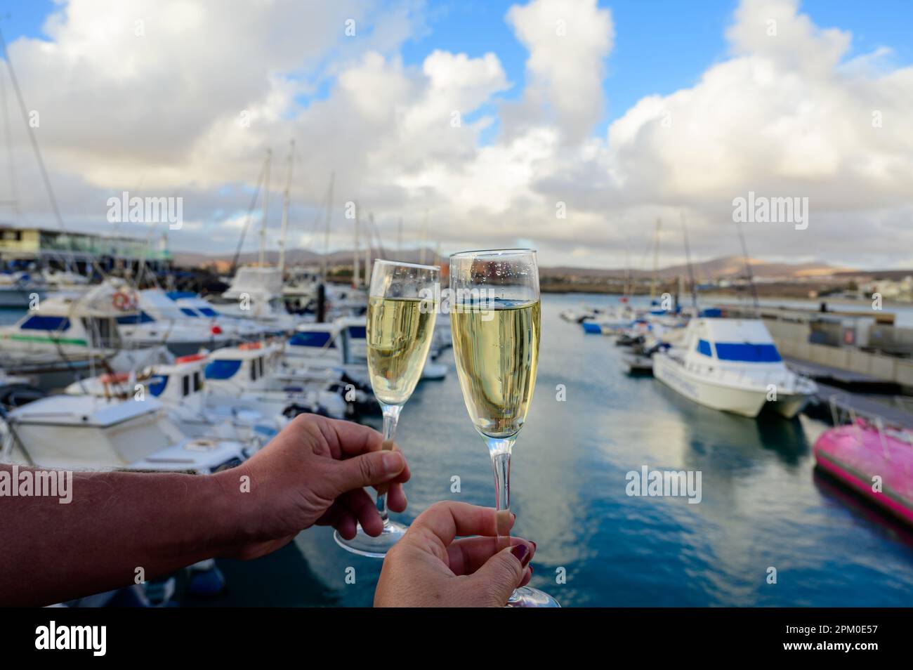 Everyday party, hands with glasses of cava or champagne sparkling wine ...