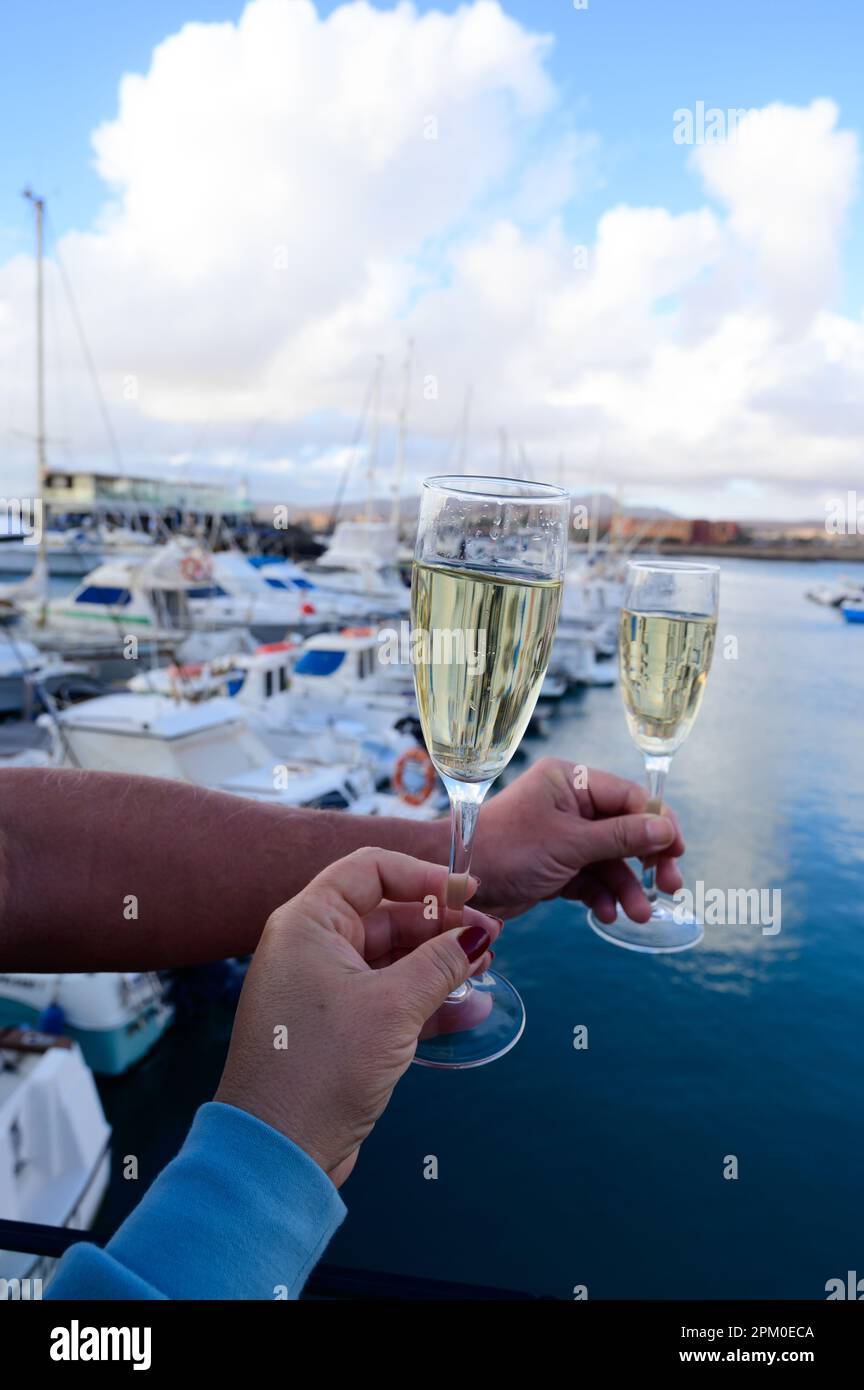 Everyday party, hands with glasses of cava or champagne sparkling wine ...