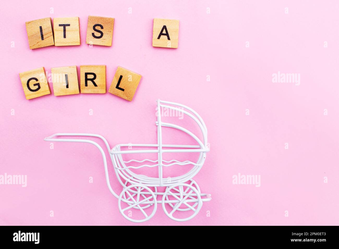 Its a girl. Little vintage white baby carriage stroller or pram on a ...