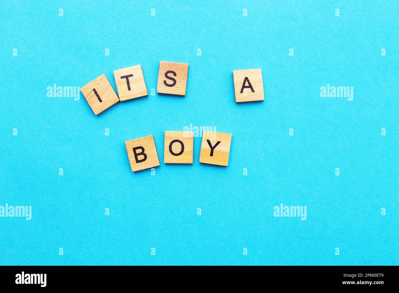 Word Its a boy by wooden cubes on a blue background. Symbol of ...