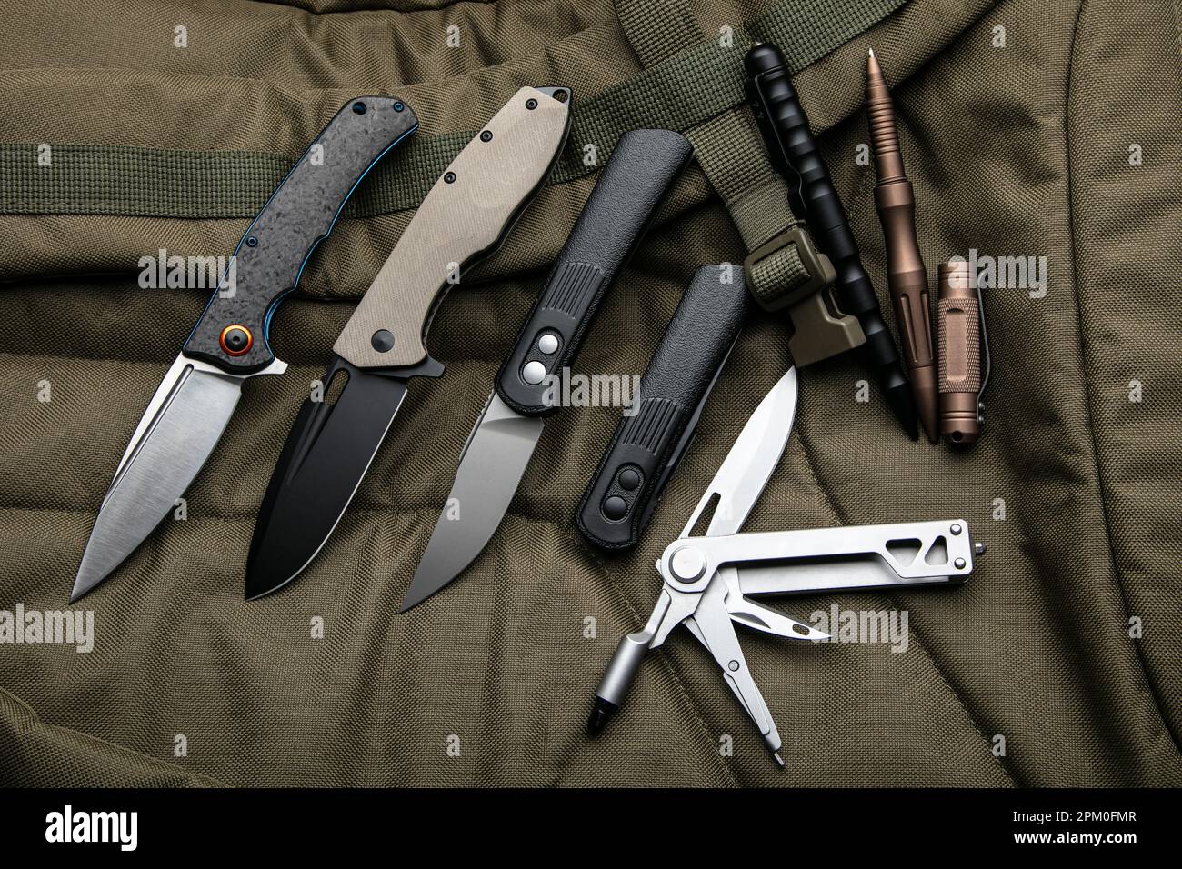 Penknives, multi-tools and tactical pens. Folding pocket knives on a ...