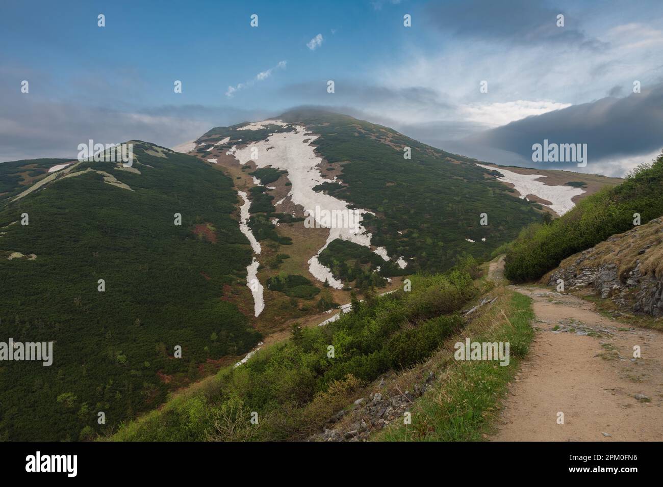 Velky Krivan, mountain in Mala Fatra, Slovakia, view from path under Chleb in spring cloudy day ...