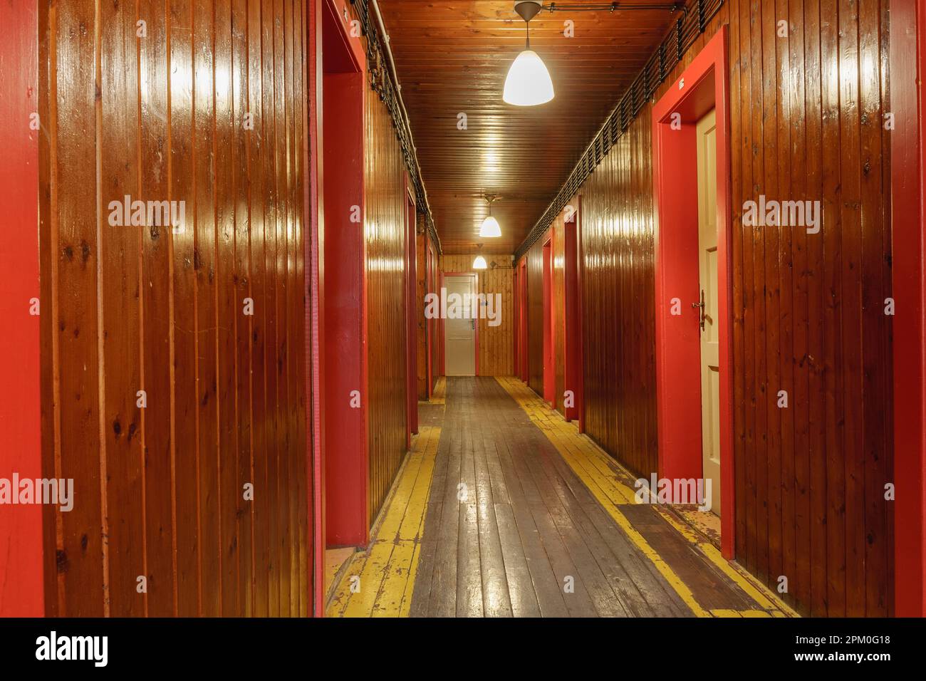 Corridor with wooden paneling inside a mountain cottage Stock Photo - Alamy