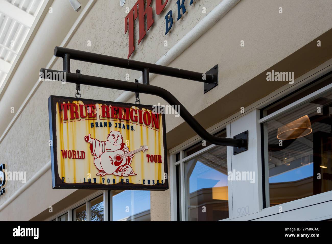 Close up of True Religion Brand Jeans store sign on building is shown ...