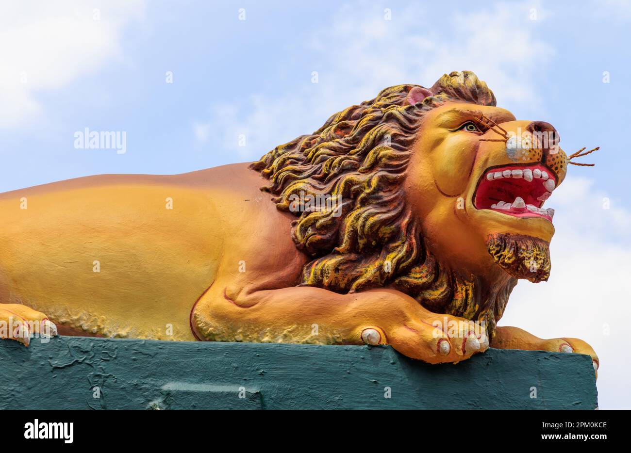 A lion lays guard on a wall of the Sri Mariamman Temple in Chinatown ...