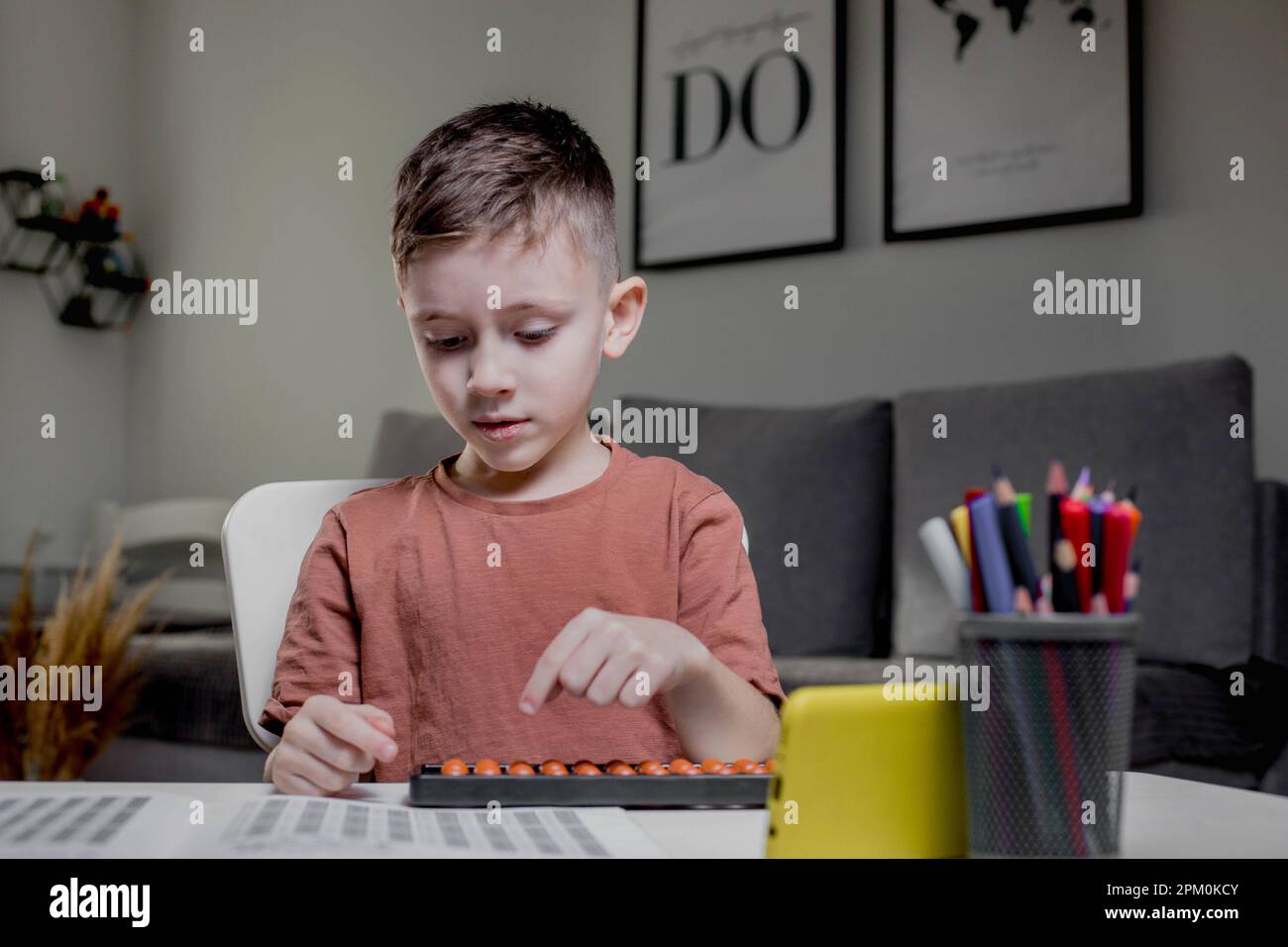 Little boy Counting with help an abacus. Mental arithmetic, brain ...