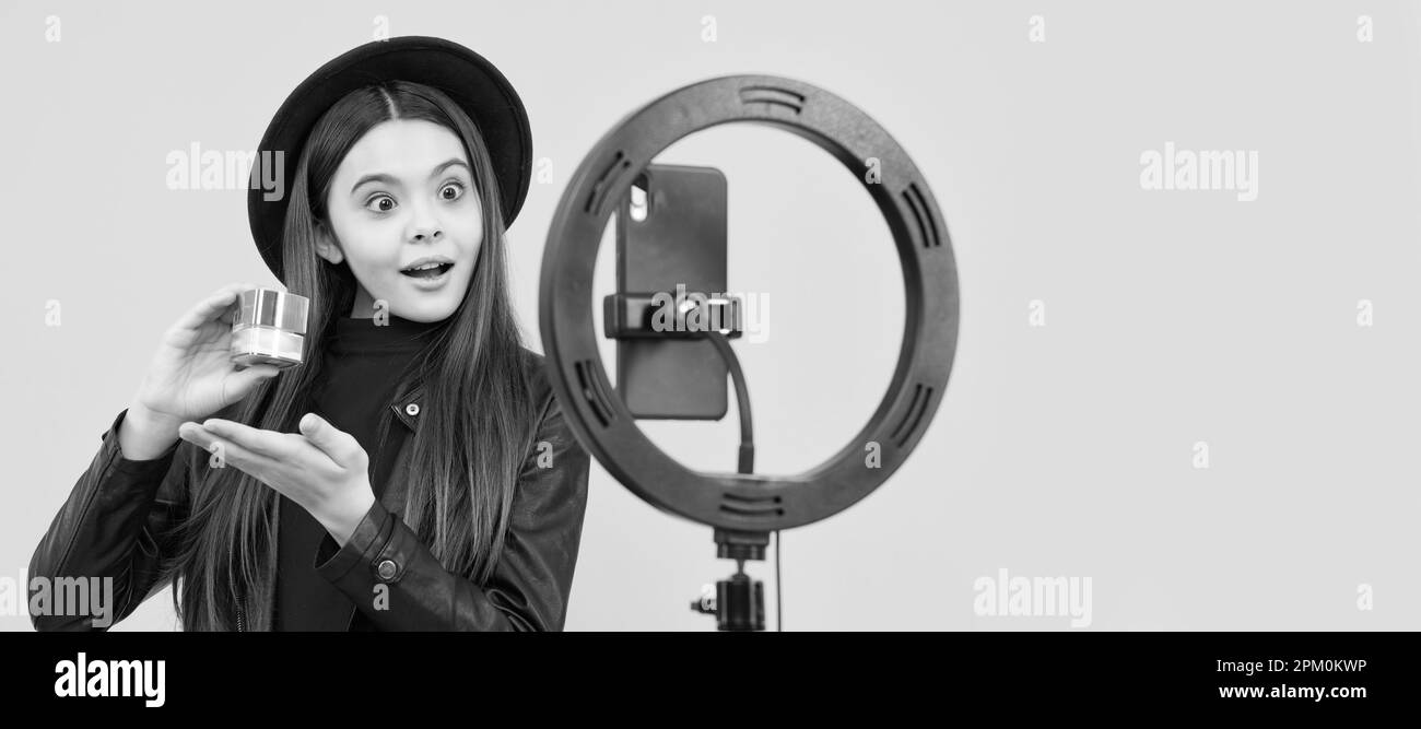 kid beauty blogger. cheerful child do makeup. vlogger with cosmetics ...