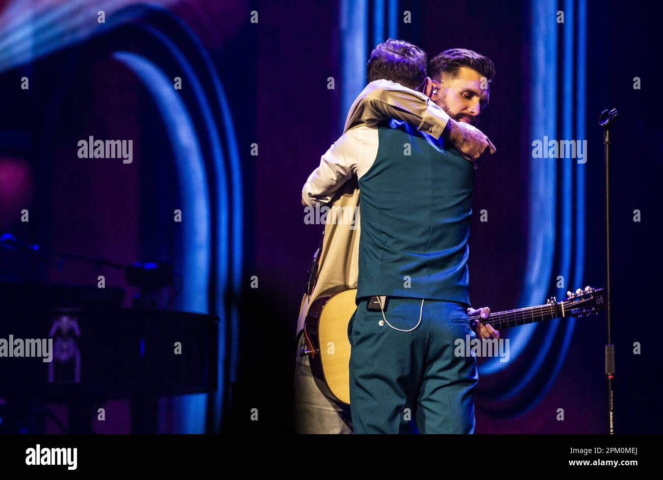 ROTTERDAM - Singers Nick & Simon give each other a hug during their ...