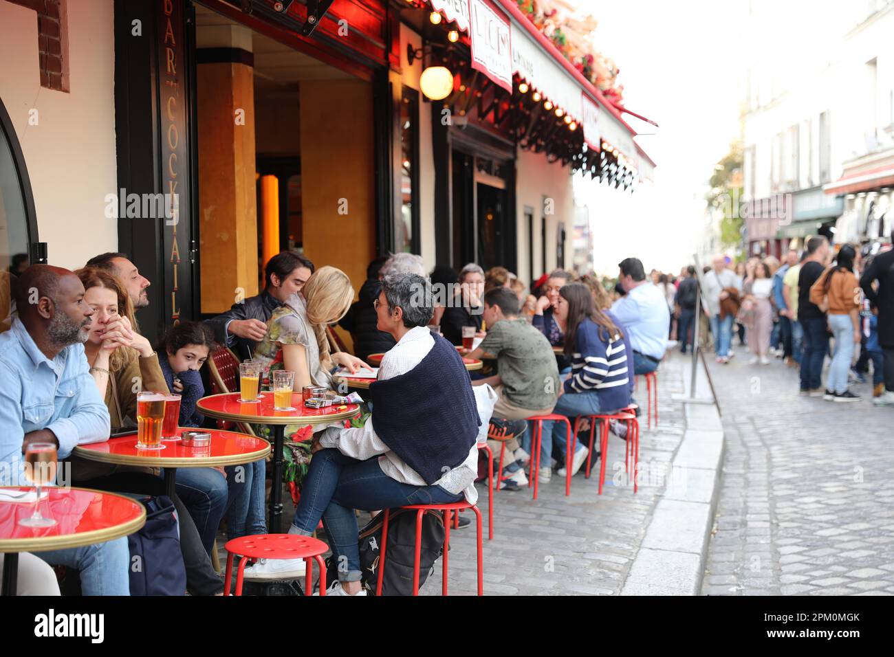 Paris, France, October 29, 2022: A lively crowd of tourists enjoys a ...