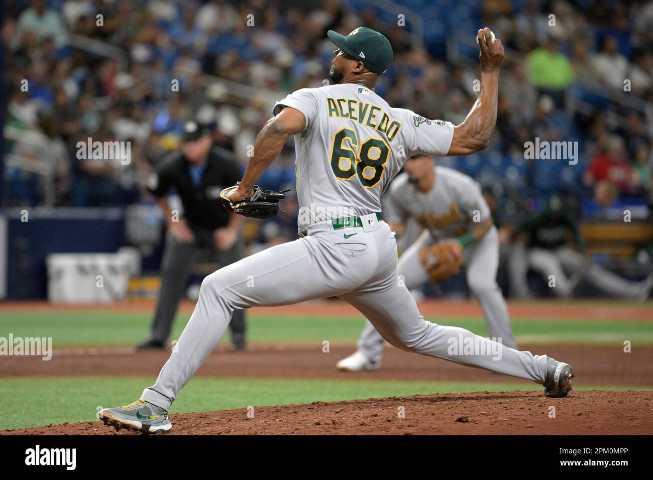 Oakland Athletics relief pitcher Domingo Acevedo (68) throws to home ...