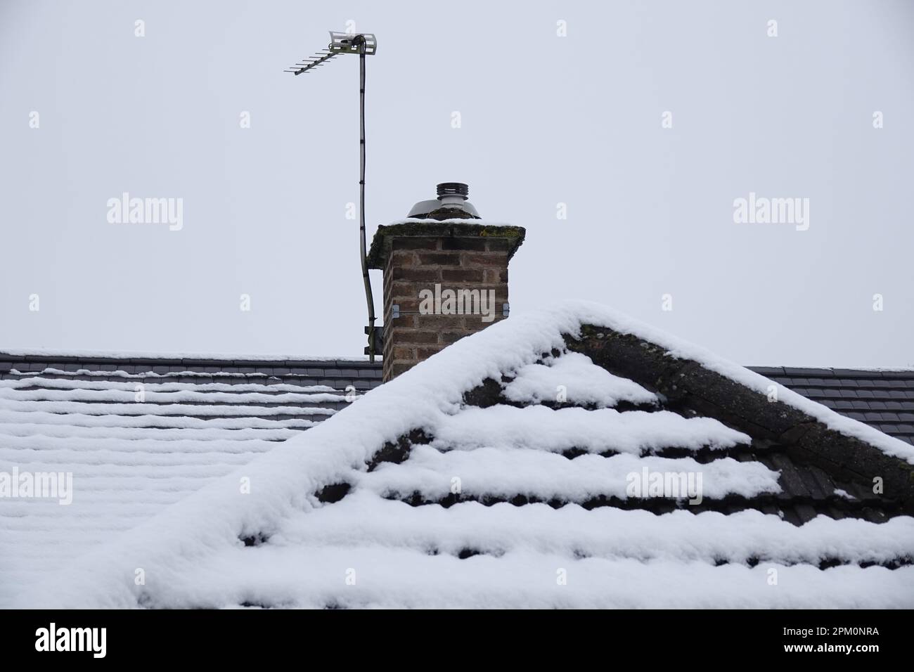 A snowy rooftop and chimney Stock Photo - Alamy