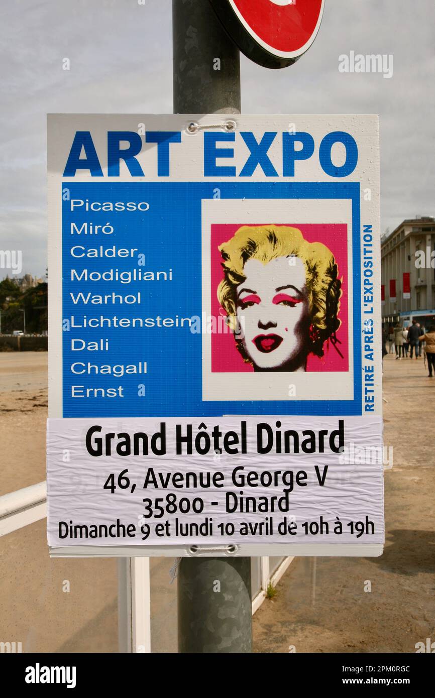 A street sign advertising an Art Expo Exhibition at the Grand Hotel in ...