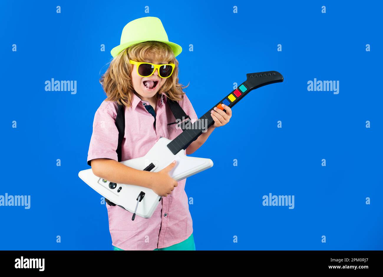 Little boy playing guitar like a rock-star. Child musician guitarist ...