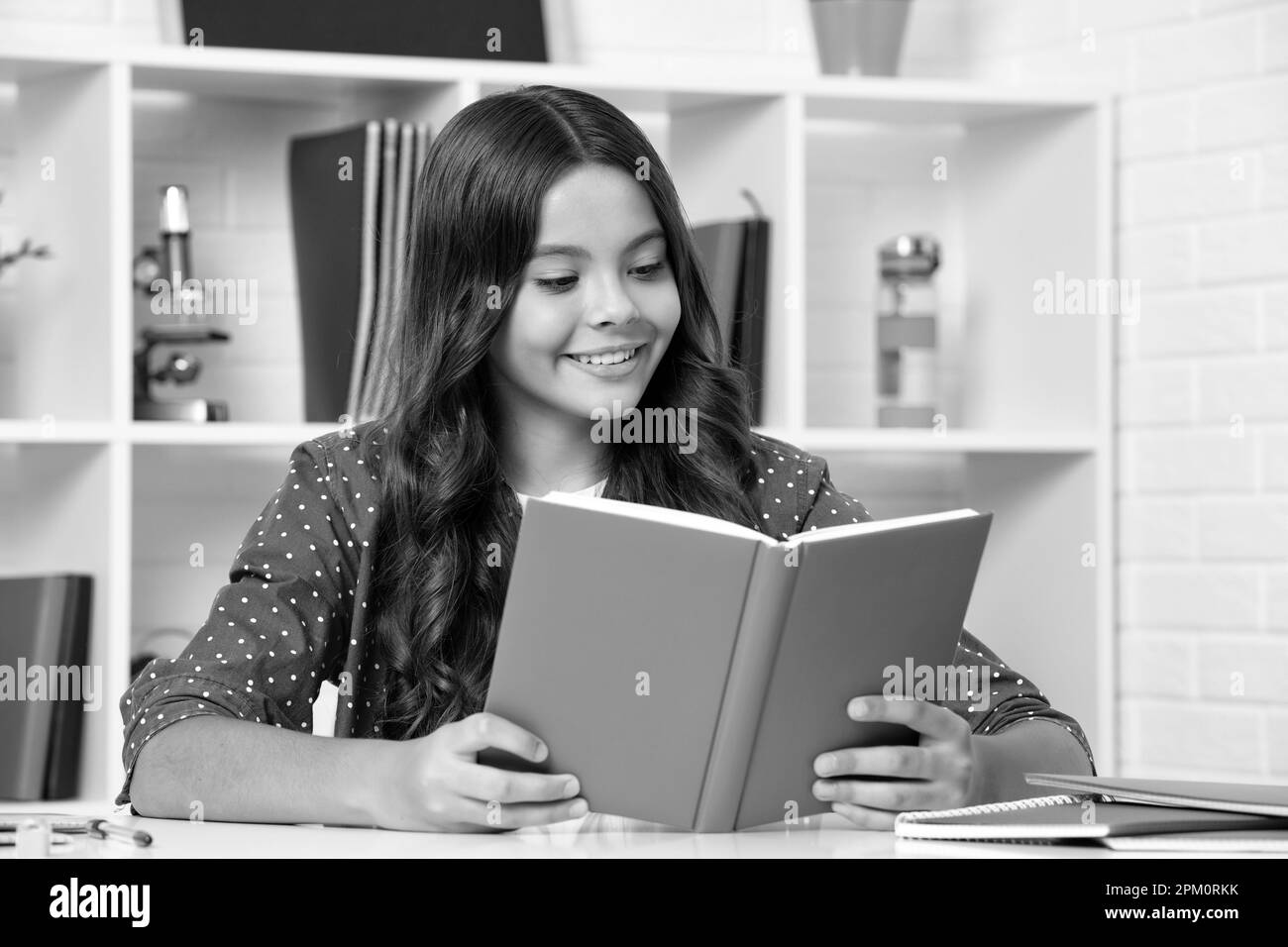 Back to school. Teenager school girl reading book ready to learn. Happy ...