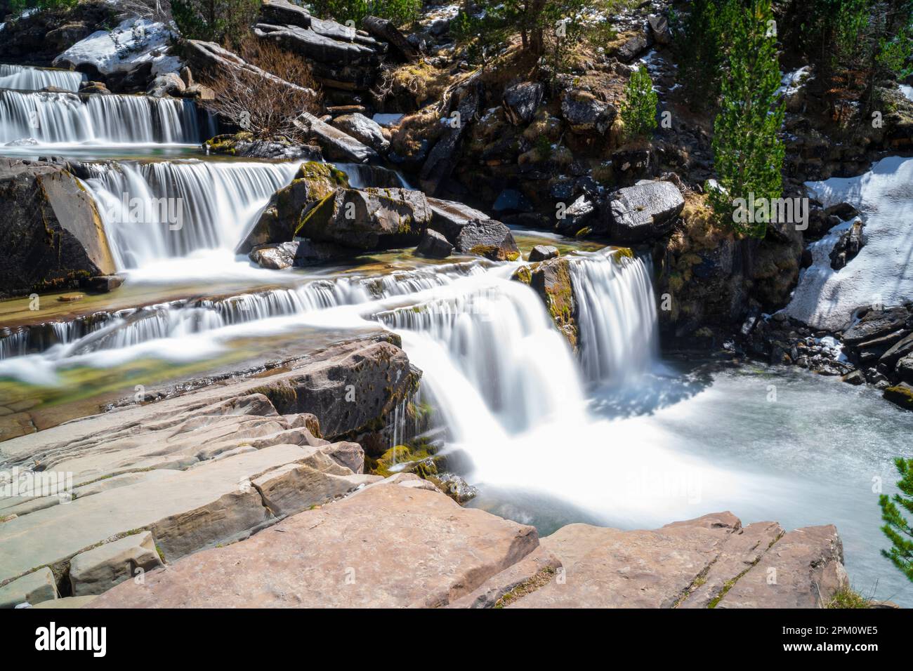 waterfall in the river in Ordesa National Park in the spanish Pyrenees ...
