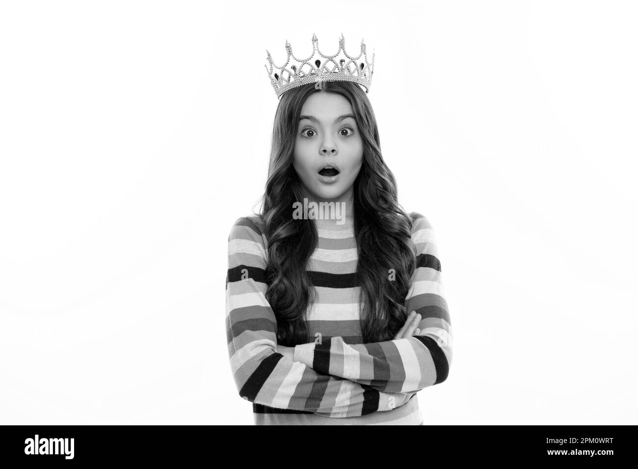 Little queen wearing golden crown. Teenage girl princess holding crown ...
