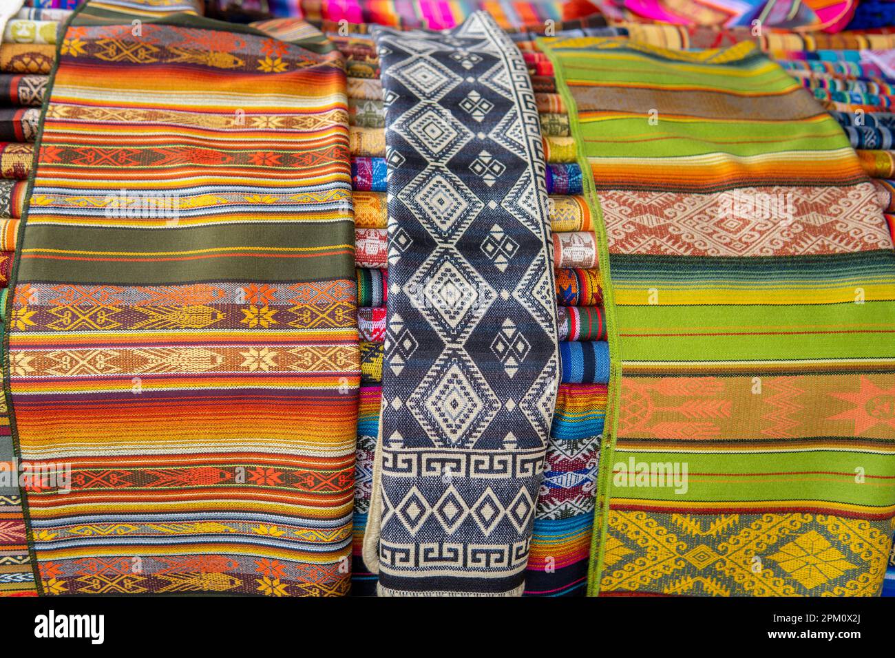 Fabrics woven with Andean designs in the ponchos market in Otavalo ...