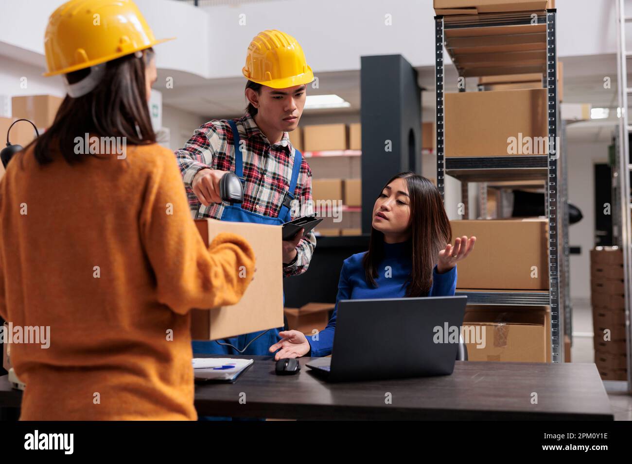 Delivery service managers asian team supervising parcels receiving and ...