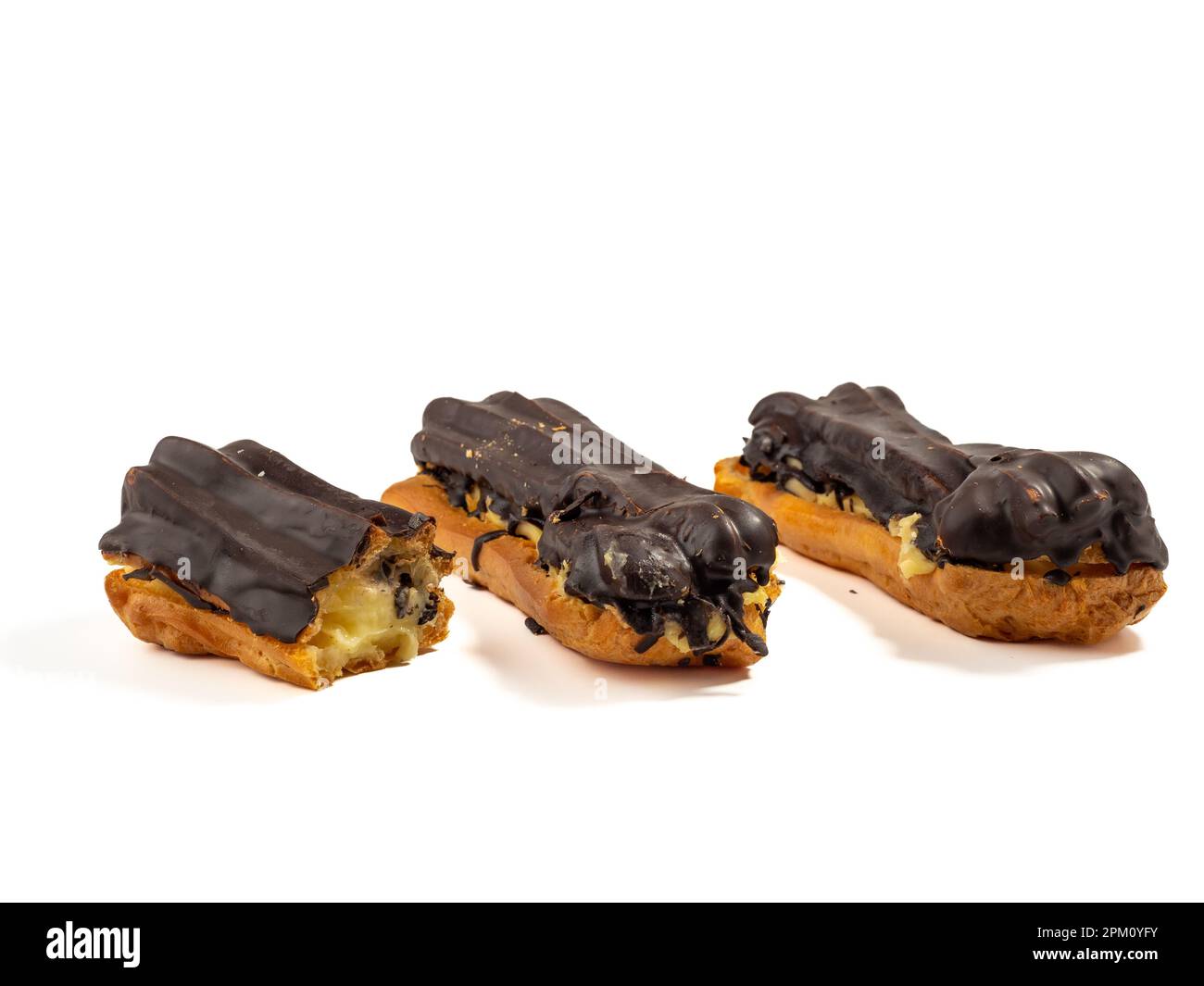 Delicious chocolate eclairs isolated on white background. Eclairs Close ...