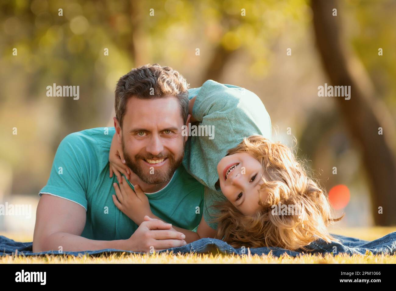 Childhood and parenthood kids concept. Happy father and son playing ...