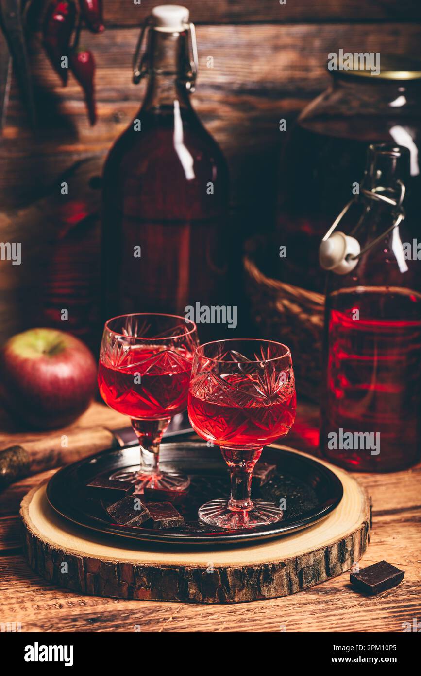 Homemade berry liqueur in rustic setting Stock Photo - Alamy