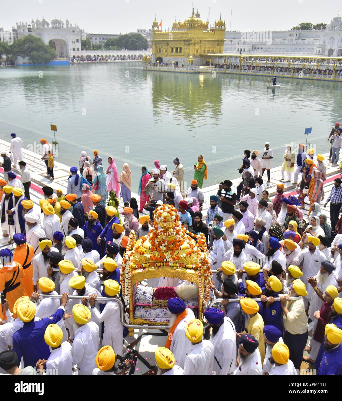 Amritsar, India. 10th Apr, 2023. AMRITSAR, INDIA - APRIL 10: Sikh devotees carry the Guru Granth ...