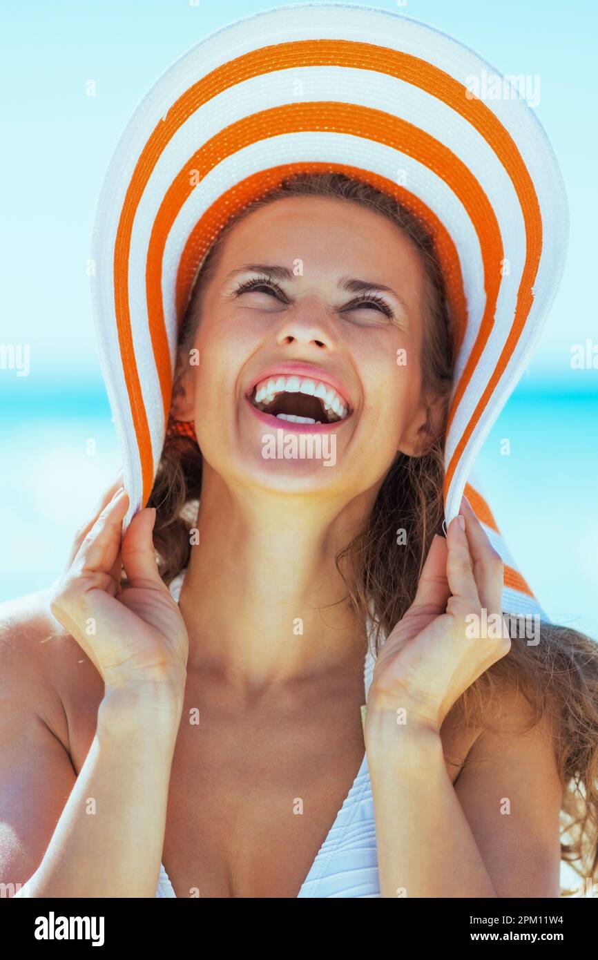 Woman smiling in orange bikini hi-res stock photography and images - Alamy