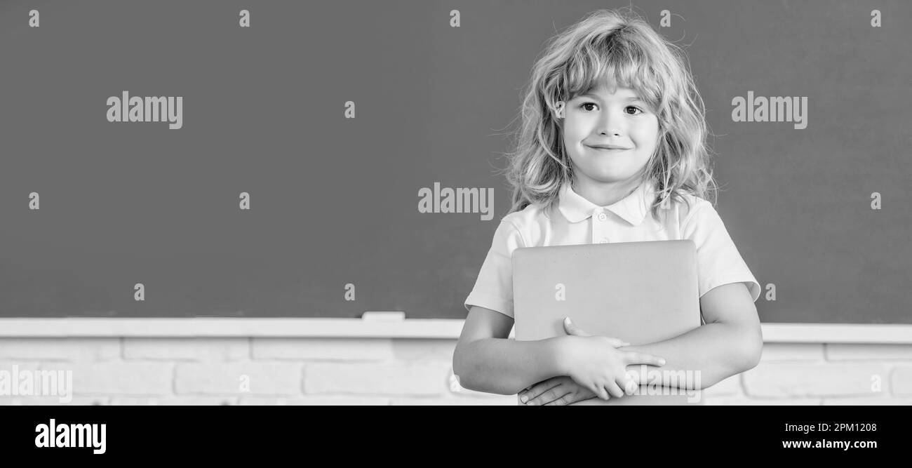 School pupil boy on blackboard, banner copy space. e-learning. child ...