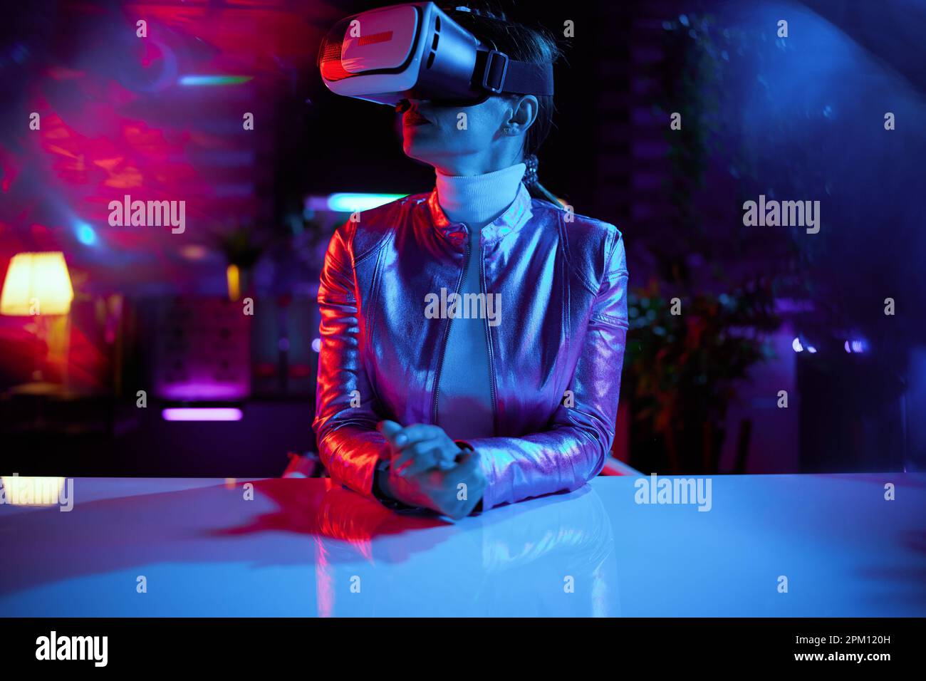Neon metaverse futuristic concept. modern 40 years old woman in vr ...