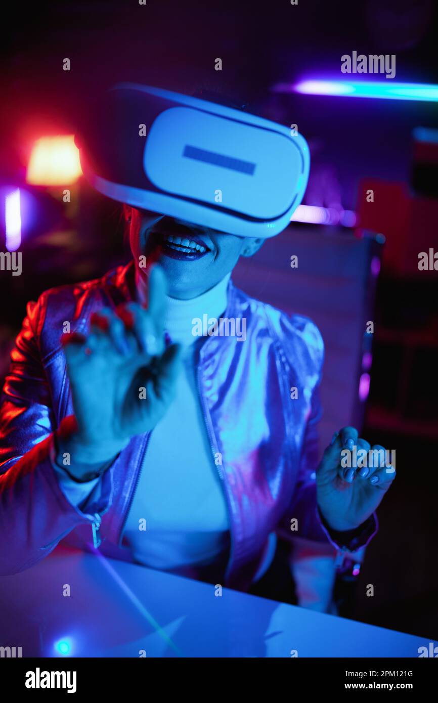 Neon metaverse futuristic concept. happy trendy business woman in ...
