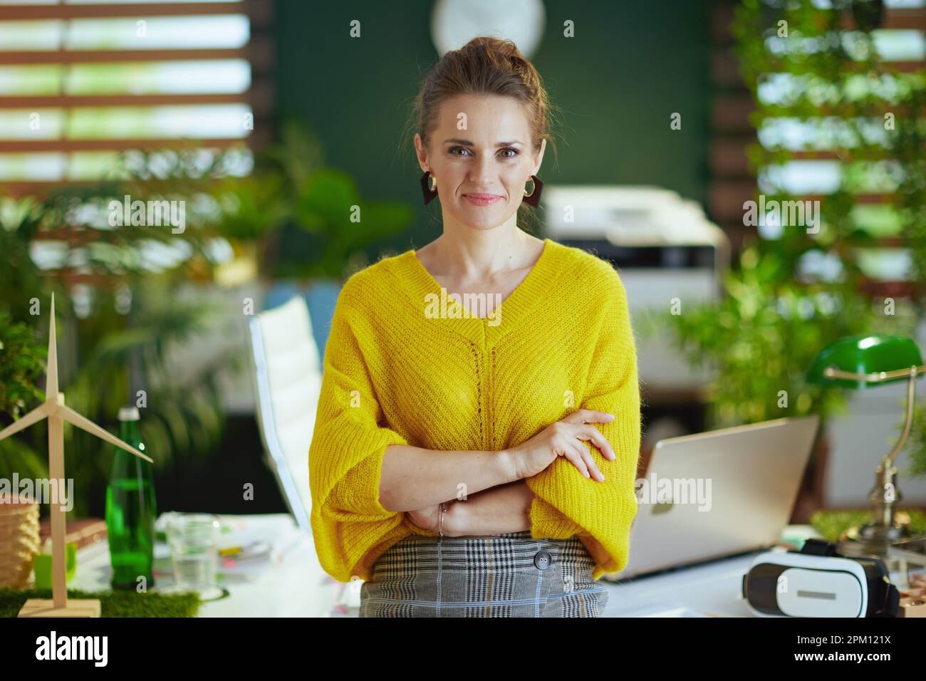 smiling elegant 40 years old small business owner woman in yellow ...