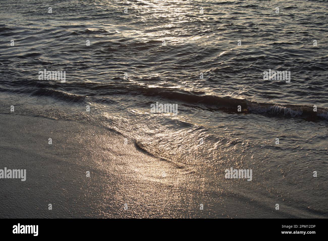 Sea shore during sunset in Lima Peru wet sand Stock Photo - Alamy